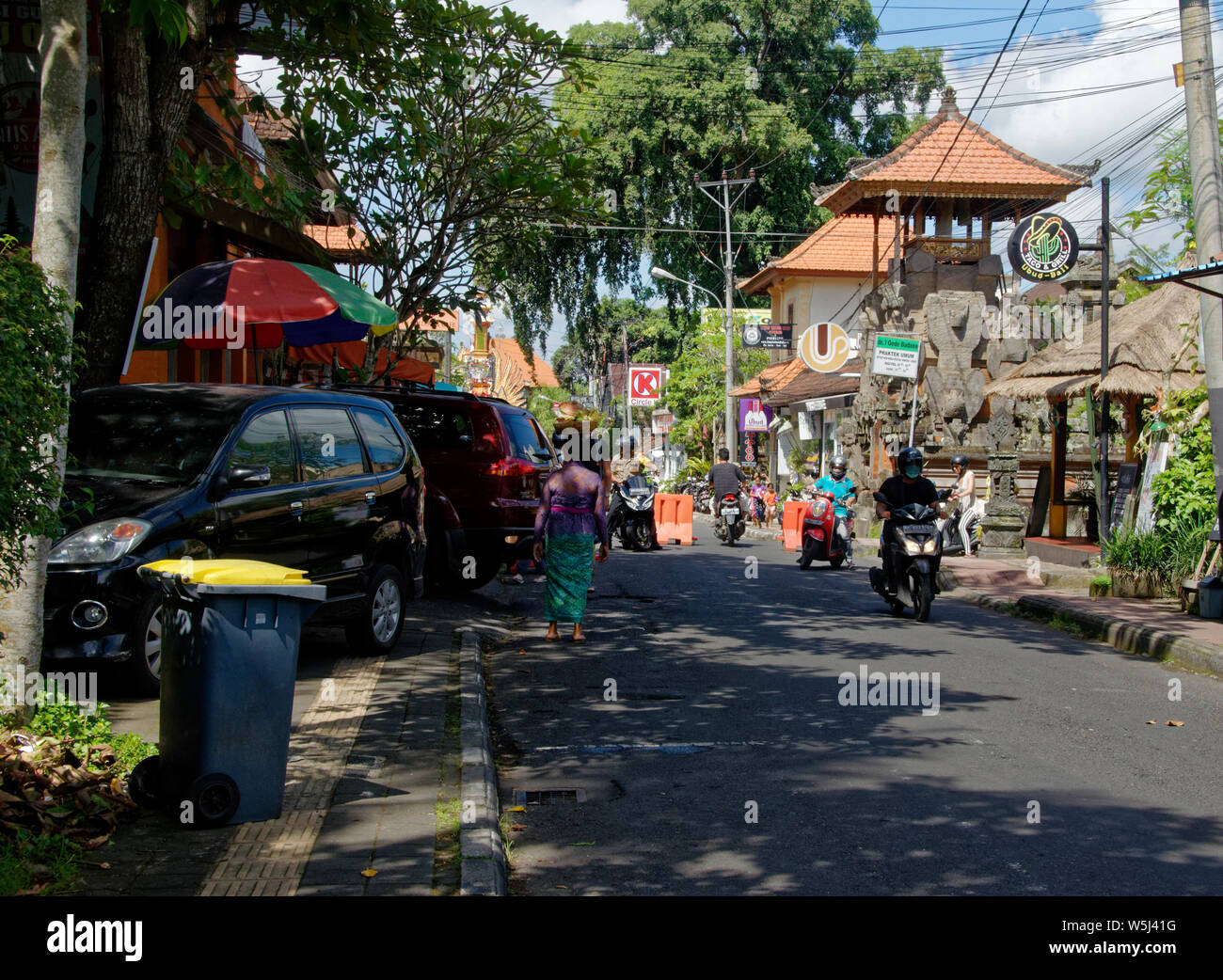 Busy street scene of Ubud, typical outside the immediate centre of the ...
