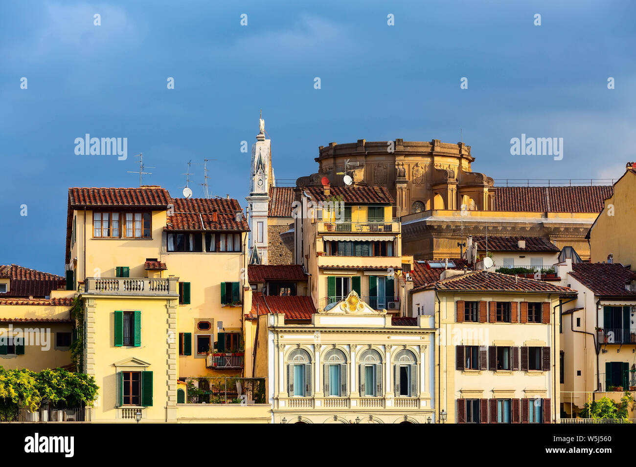 City view with tower, and traditional italian houses near Arno river ...