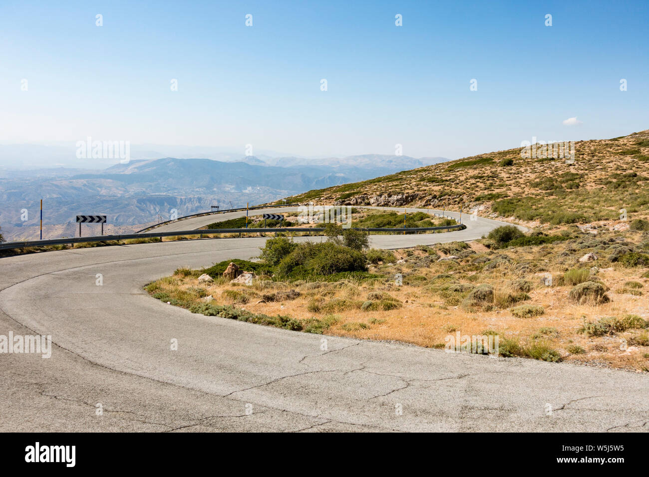 Winding road at 2000m altitude, Sierra Nevada mountains, summer season ...