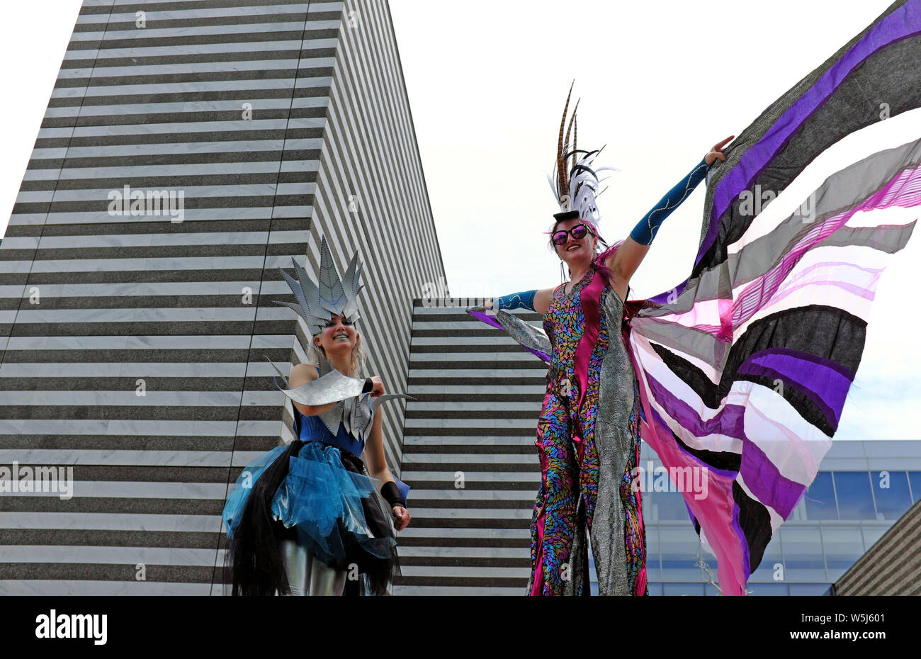 Stilted women dressed in surreal outfits take part in the 2019 Parade ...