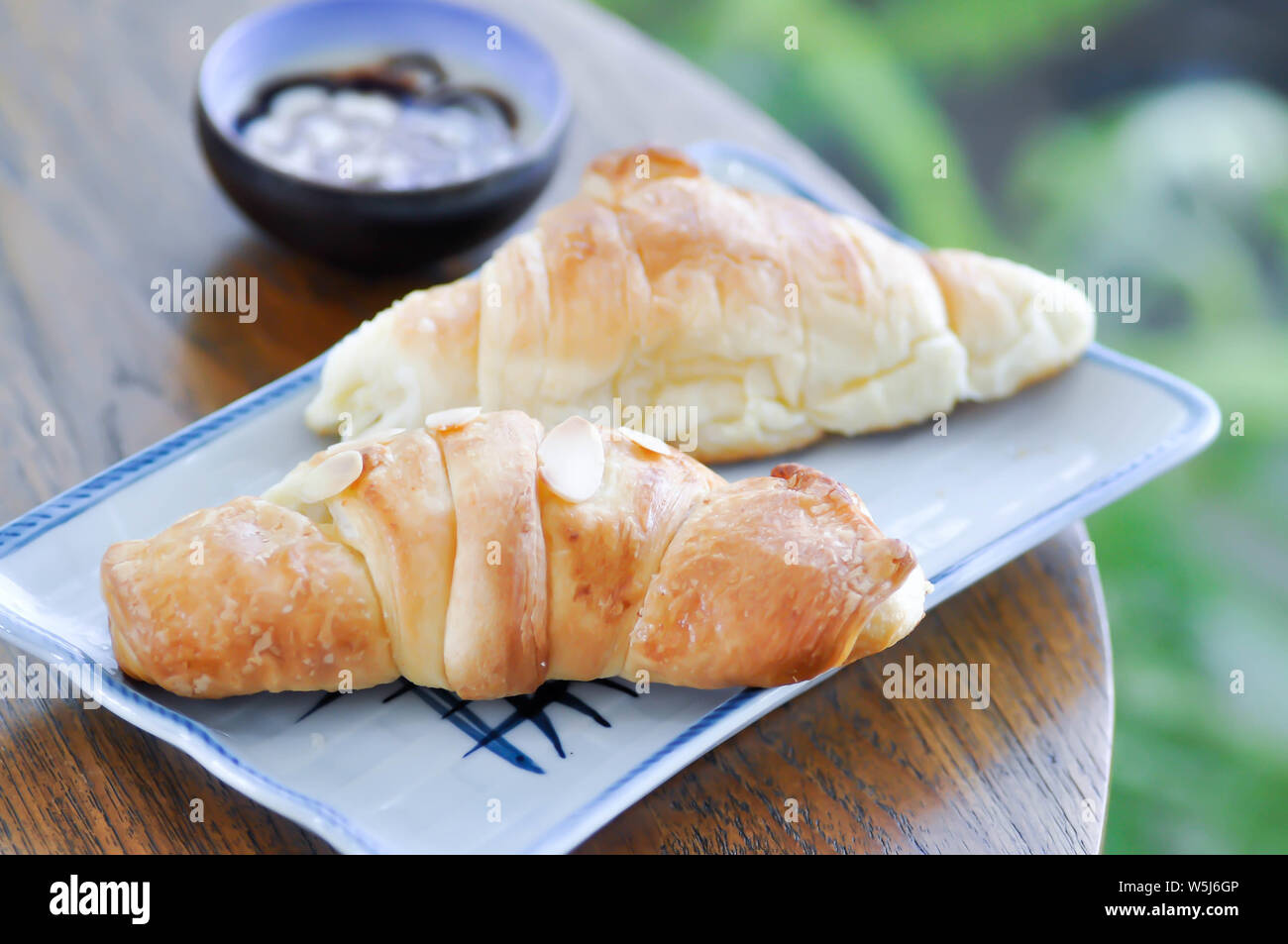croissant and almond croissant with dip Stock Photo - Alamy