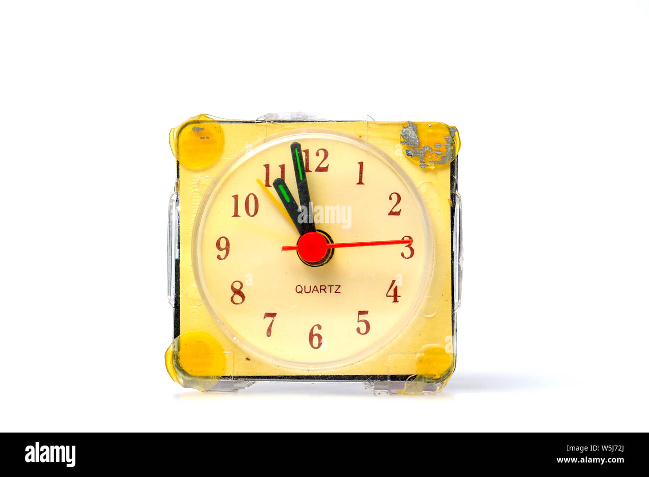 pictureof a vintage damaged alarm clock on white Stock Photo - Alamy
