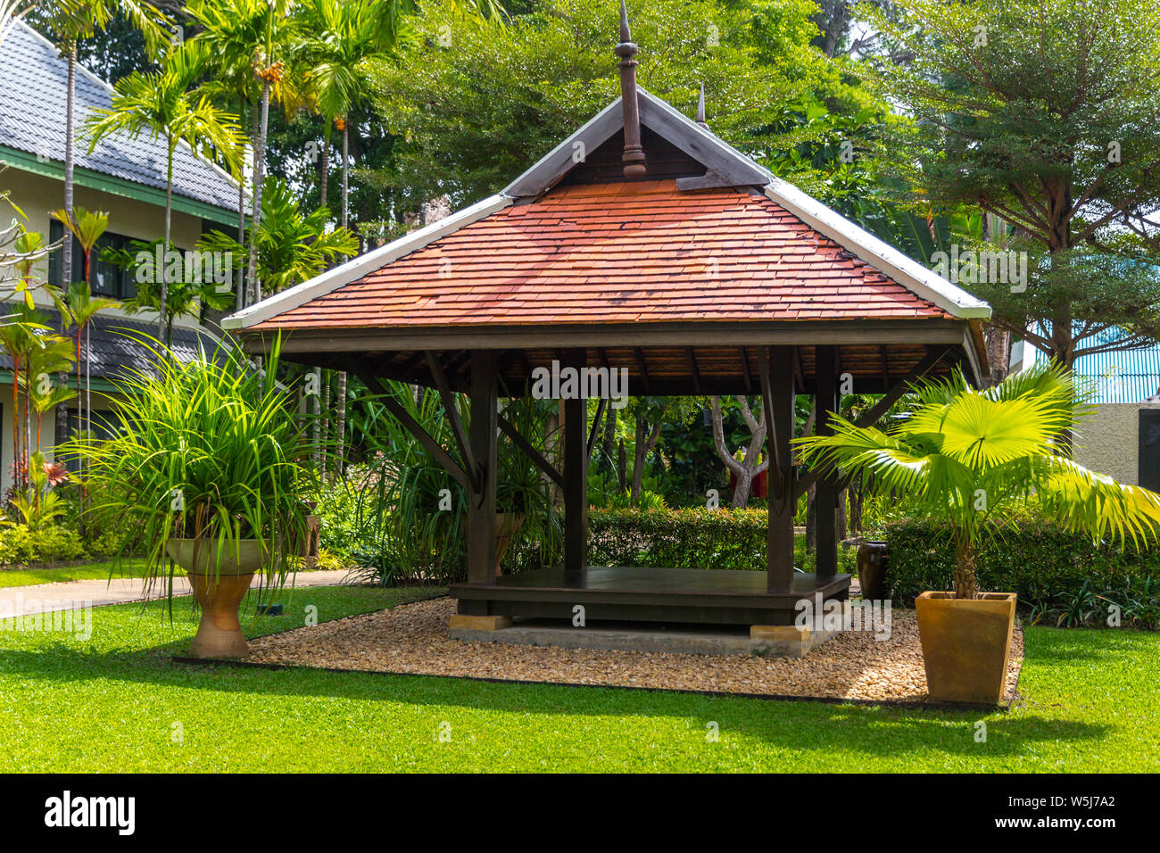 beautiful wooden gazebo and nice green lawn Stock Photo - Alamy