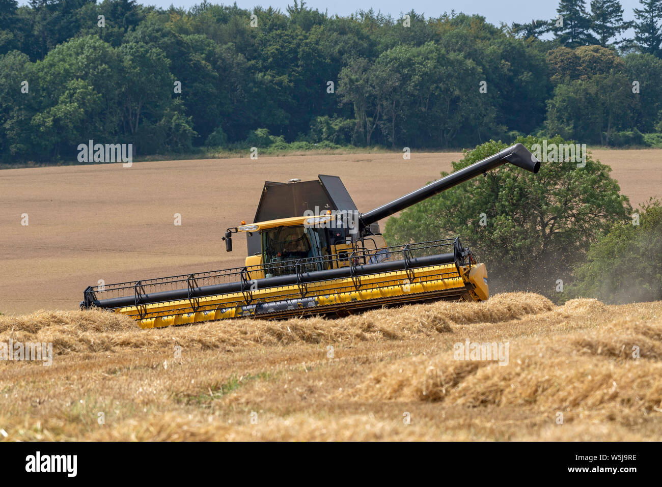 Cheltenham, Gloucestershire, England, UK, July 2019. Combine harvester ...