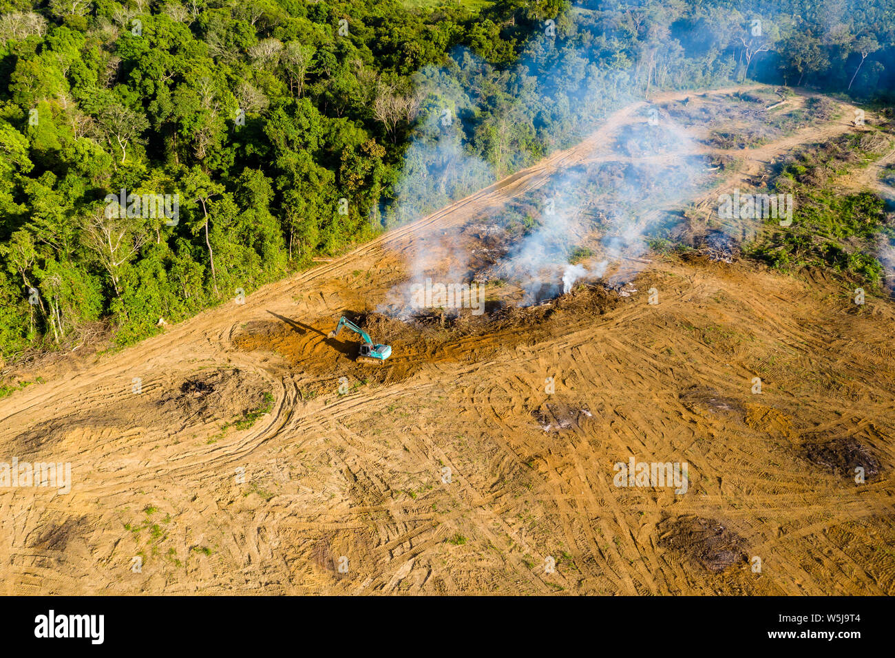 Top down aerial view of deforestation - jungle being removed and burnt ...
