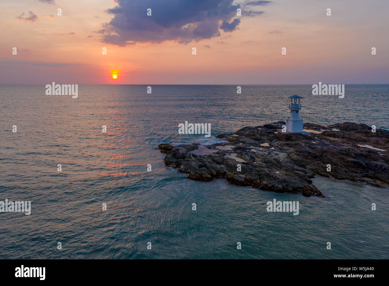Small rocky island lighthouse hi-res stock photography and images - Alamy