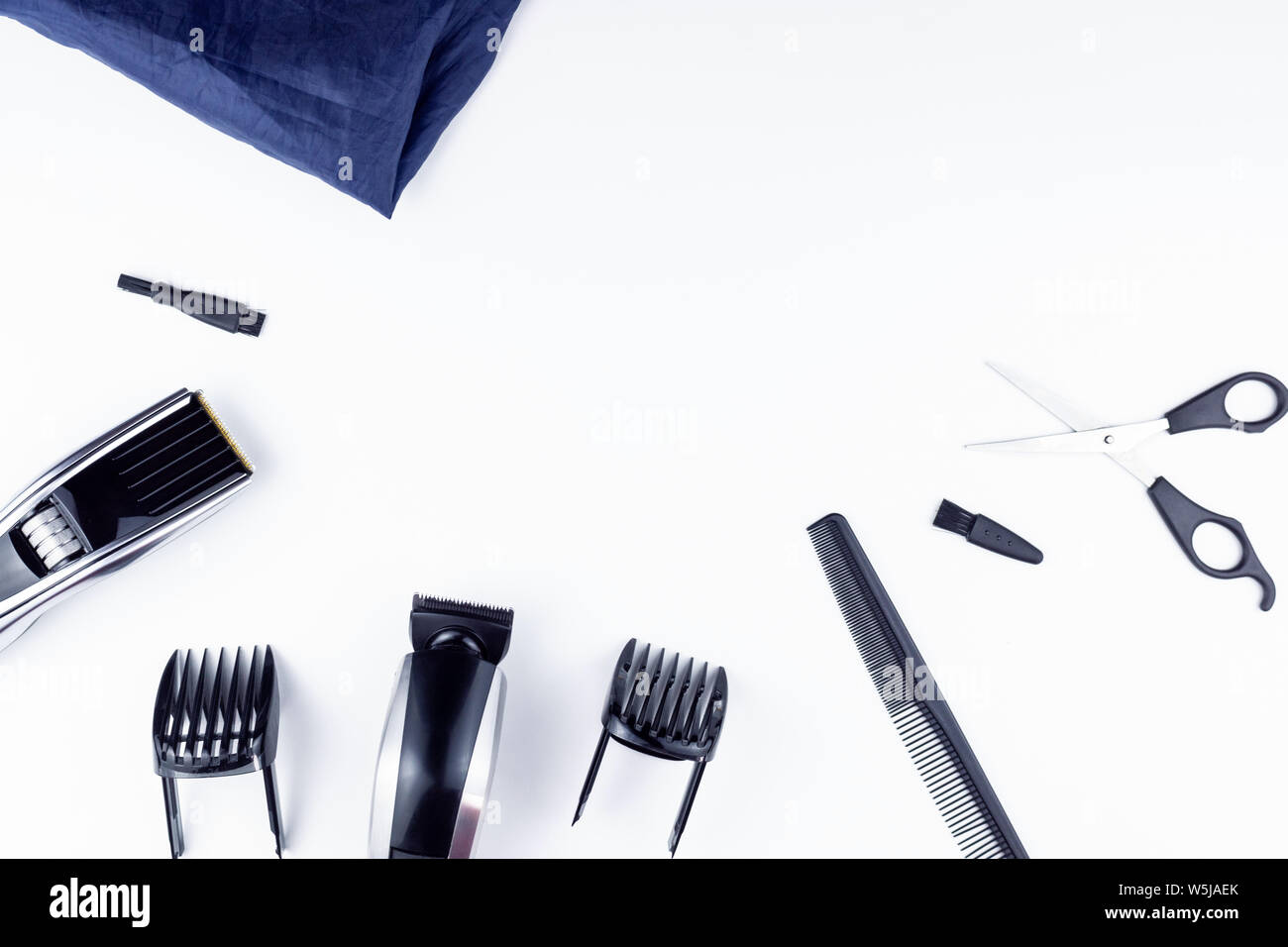 machine for haircuts. On the table are scissors and a comb. Barbershop ...
