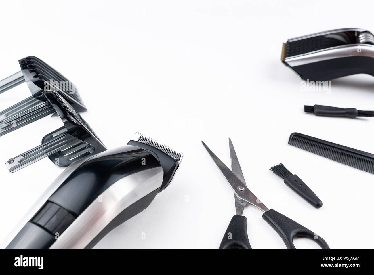machine for haircuts. On the table are scissors and a comb. Barbershop ...
