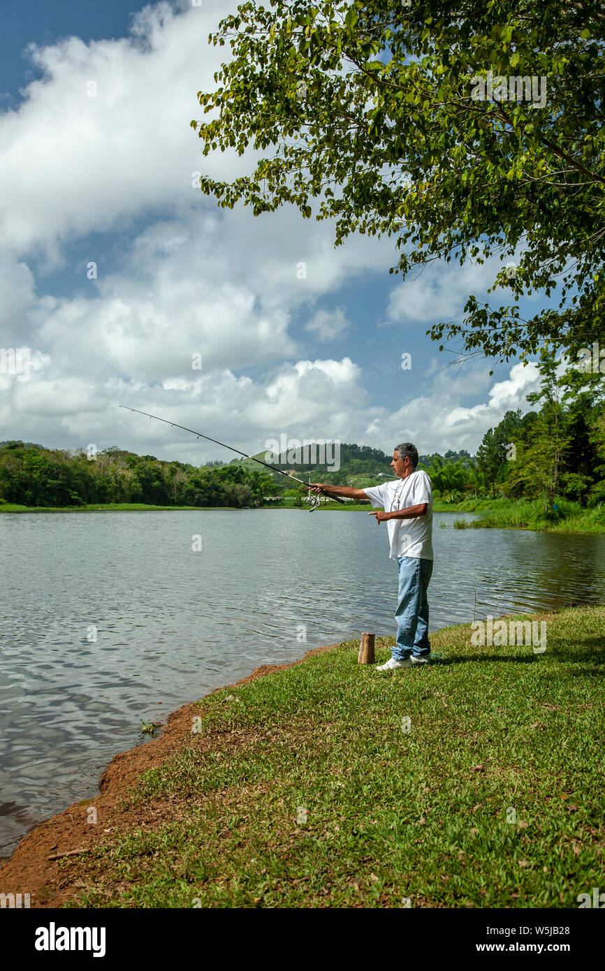 Fishing on a mountain lake, Cidra, Puerto Rico Stock Photo - Alamy