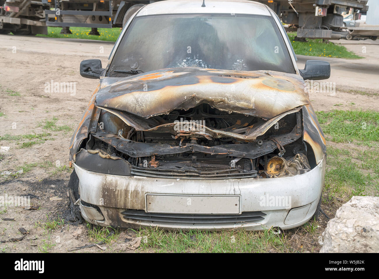 Burnt car on the street Stock Photo - Alamy