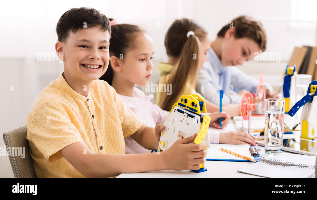 Stem education. Boy creating robot at lab Stock Photo - Alamy
