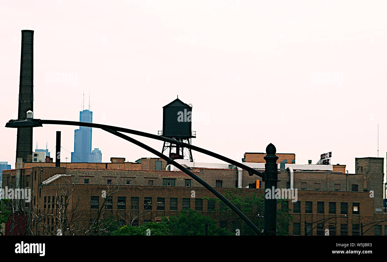 water tank, smoke stack and high rise building Stock Photo - Alamy