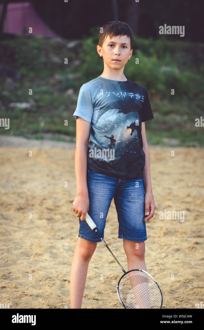 the boy with the racket from badmindton Stock Photo - Alamy