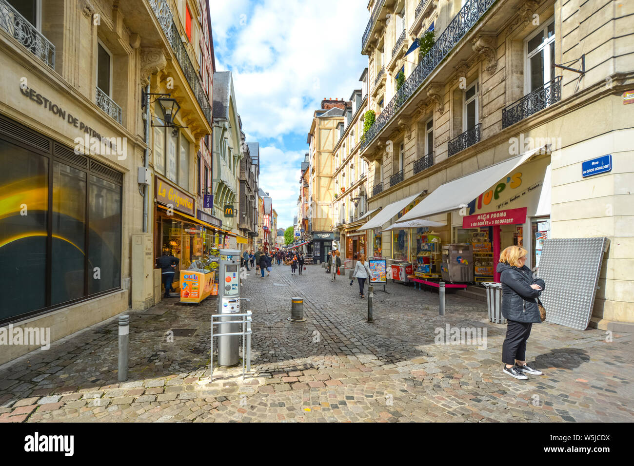 One of the many picturesque colorful streets with shops and cafes in ...