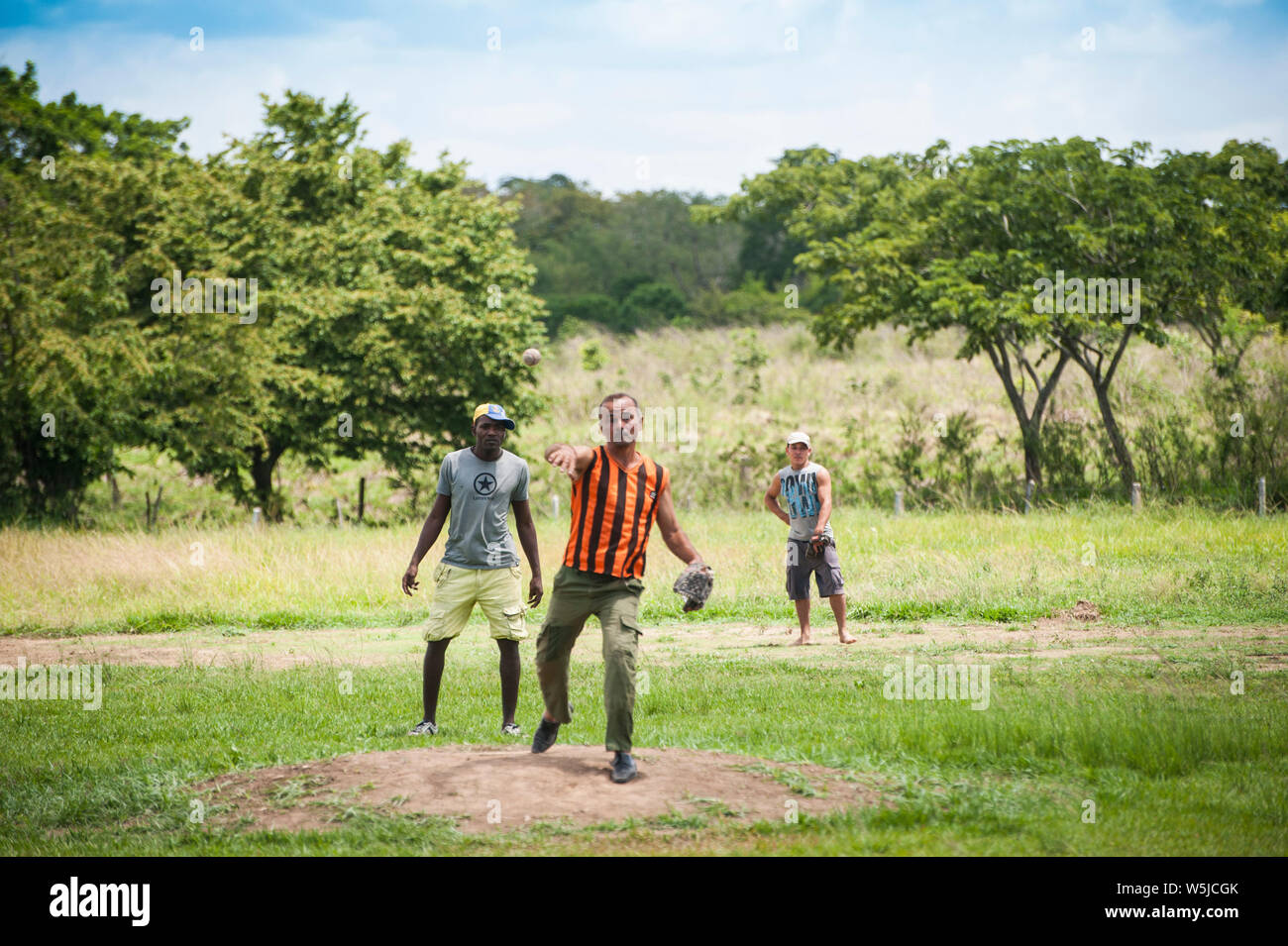 Baseball players on playing field Stock Photo - Alamy