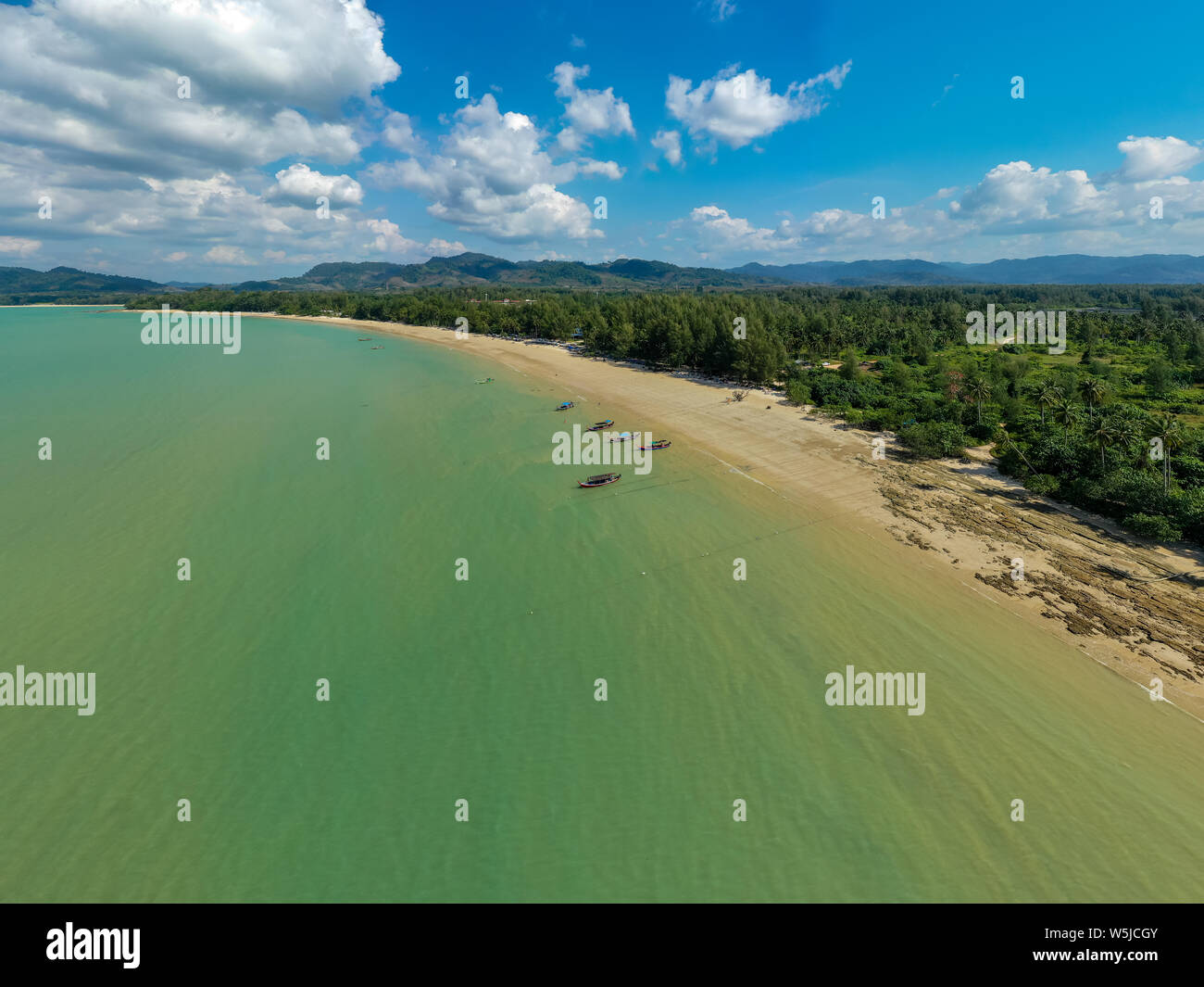 Aerial view of a quiet tropical sandy beach and shallow ocean (Coconut ...