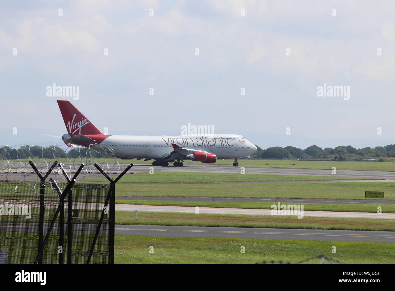 Virgin plane landing manchester airport hi-res stock photography and ...