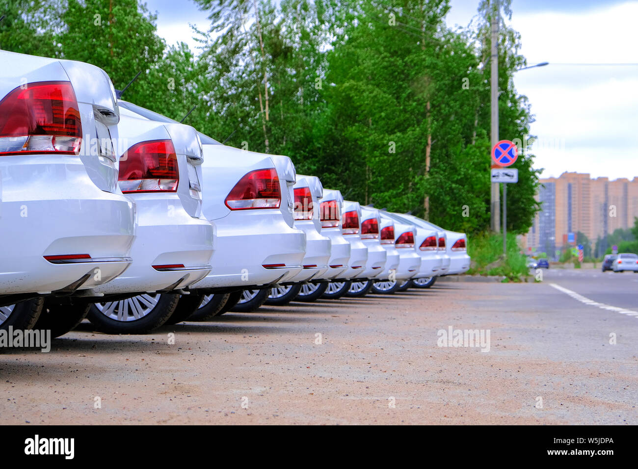 A batch of new white cars. Parking in a row. Registration in the ...