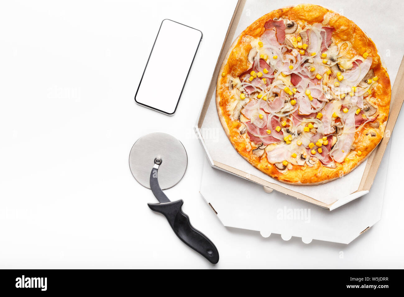 Fresh pizza in cardboard box and smartphone with blank screen Stock ...