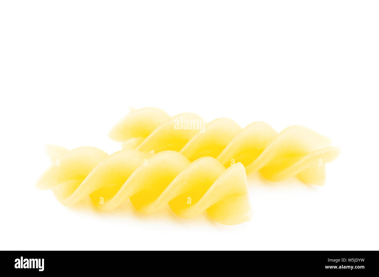 uncooked fusilli pasta noodles isolated on white background Stock Photo ...