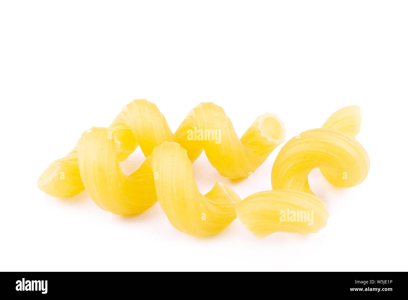 raw Cellentani pasta isolated on white background Stock Photo - Alamy