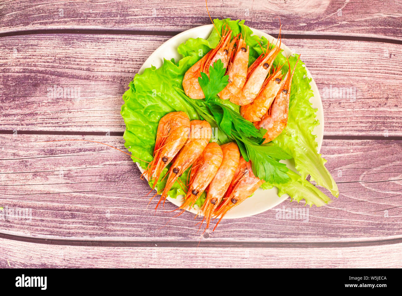 Cooked Atlantic prawns served with parsley and lemon salad Stock Photo ...