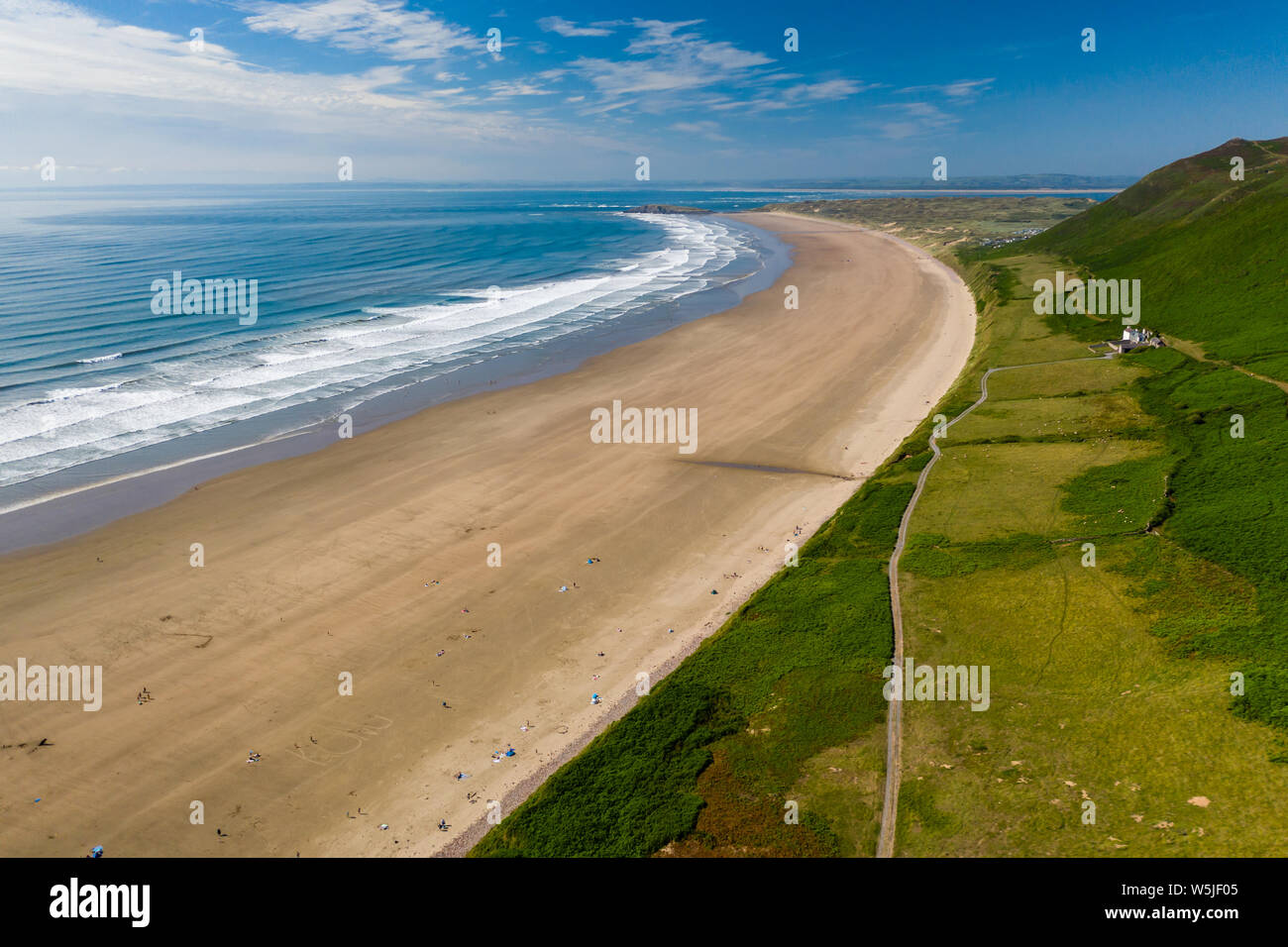 Aerial view of a huge, golden sandy beach and ocean surf Stock Photo ...
