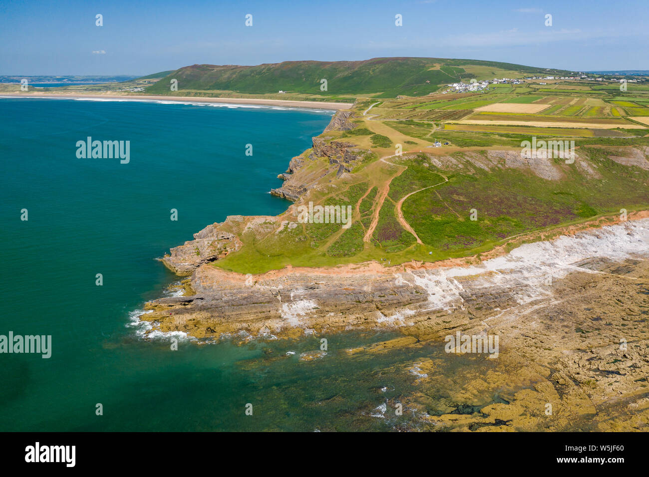 Aerial view of cliffs and waves on the Worm's Head area of the Gower ...