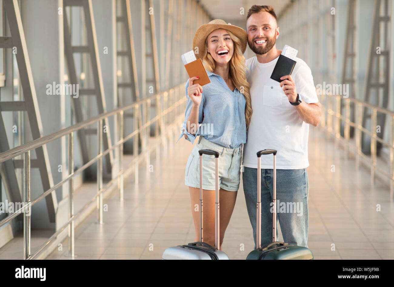 Traveling concept. Loving couple holding passports with tickets Stock ...
