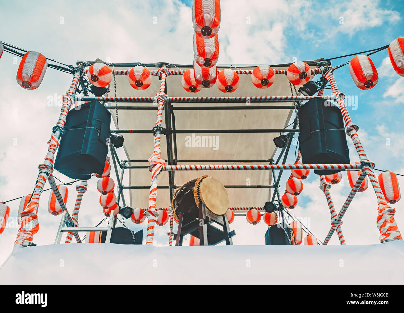 The stage of the Yagura with a big japanese taiko drum Odaiko. Paper ...