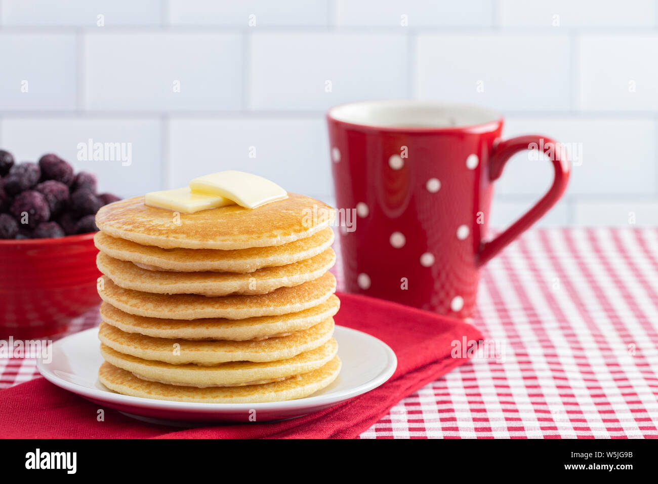 Stack of Freshly Made Pancakes on a Gingham Tablecloth Stock Photo - Alamy