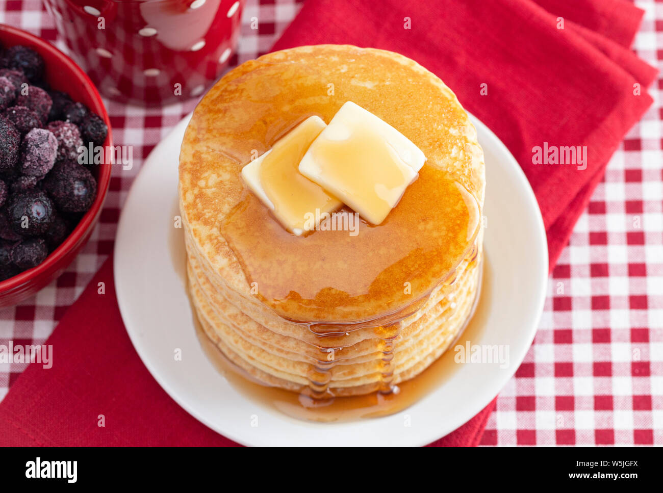 Stack of Freshly Made Pancakes on a Gingham Tablecloth Stock Photo - Alamy
