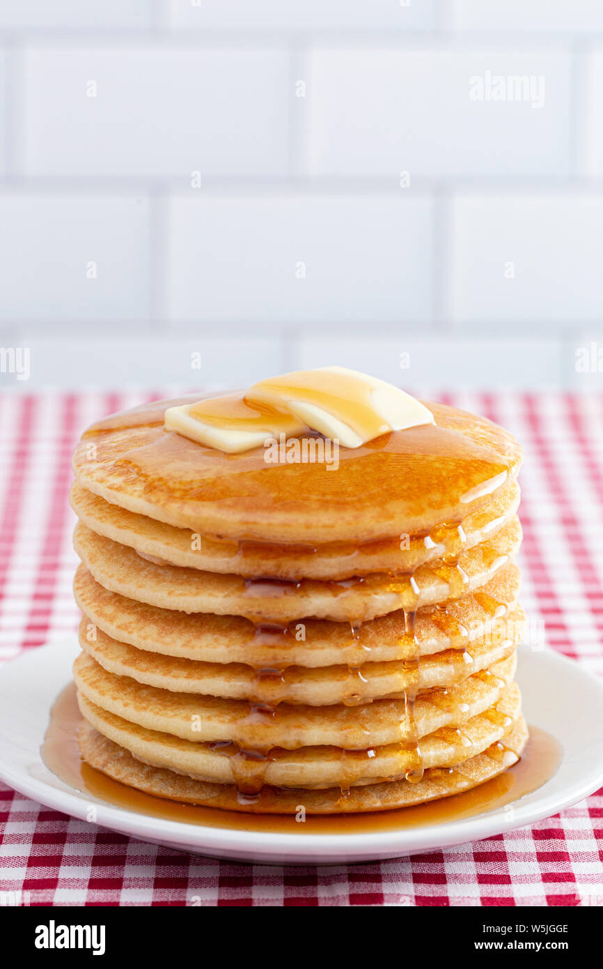 Stack of Freshly Made Pancakes on a Gingham Tablecloth Stock Photo - Alamy
