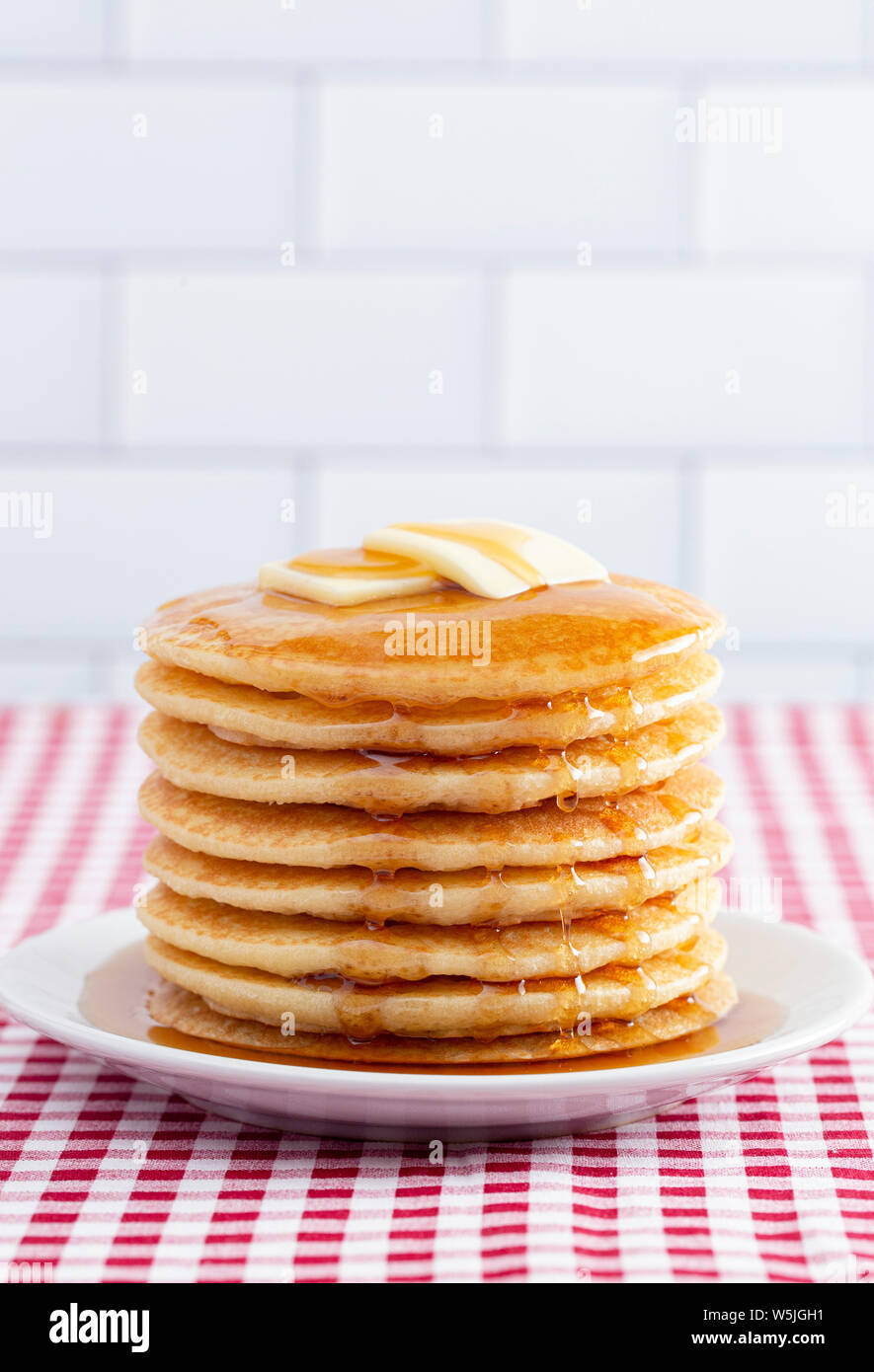 Stack of Freshly Made Pancakes on a Gingham Tablecloth Stock Photo - Alamy