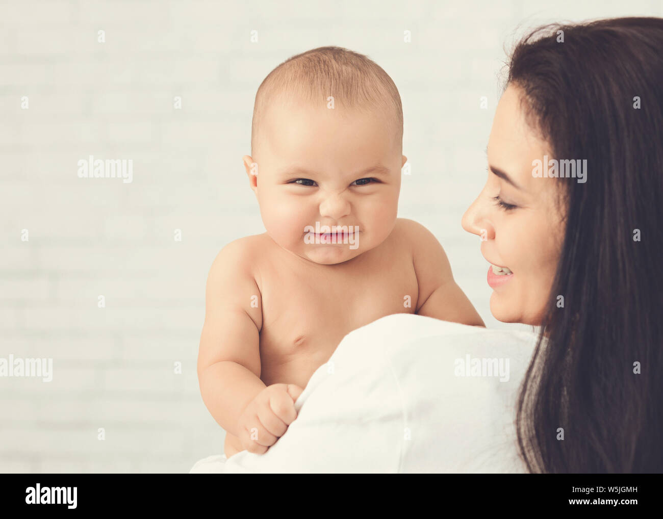 Portrait of angelic baby and his mother Stock Photo - Alamy