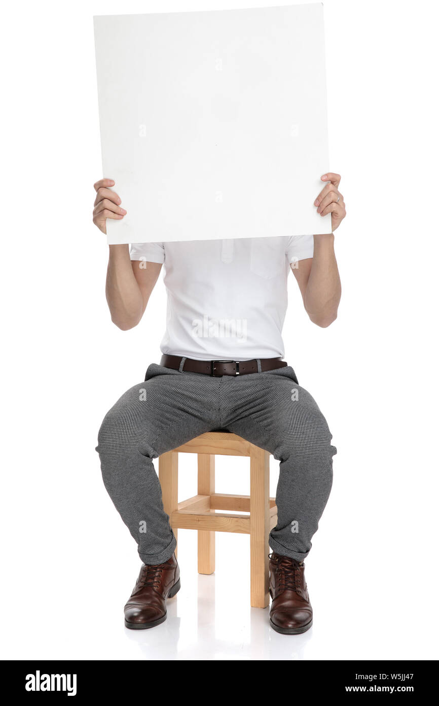 casual man covers his face with a blank board on white background Stock ...