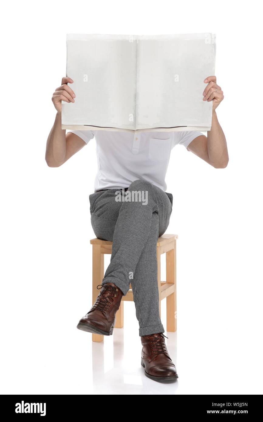 Man with newspaper over head hi-res stock photography and images - Alamy