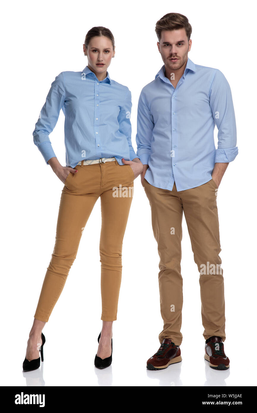 Four Young Casual Men Standing Together White Background While Wearing ...