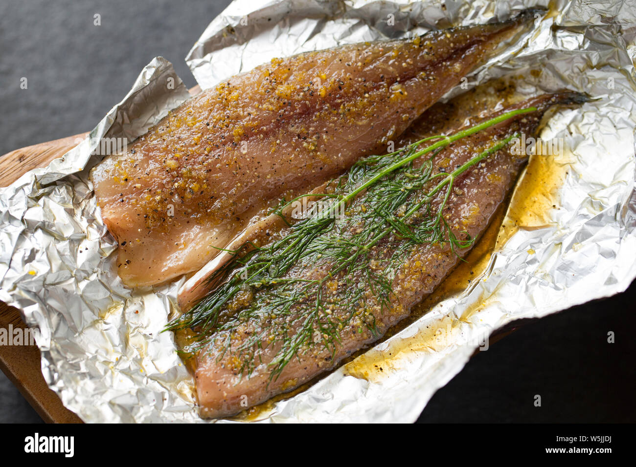 Whole raw mackerel fillets that have been used to make gravlax, or ...