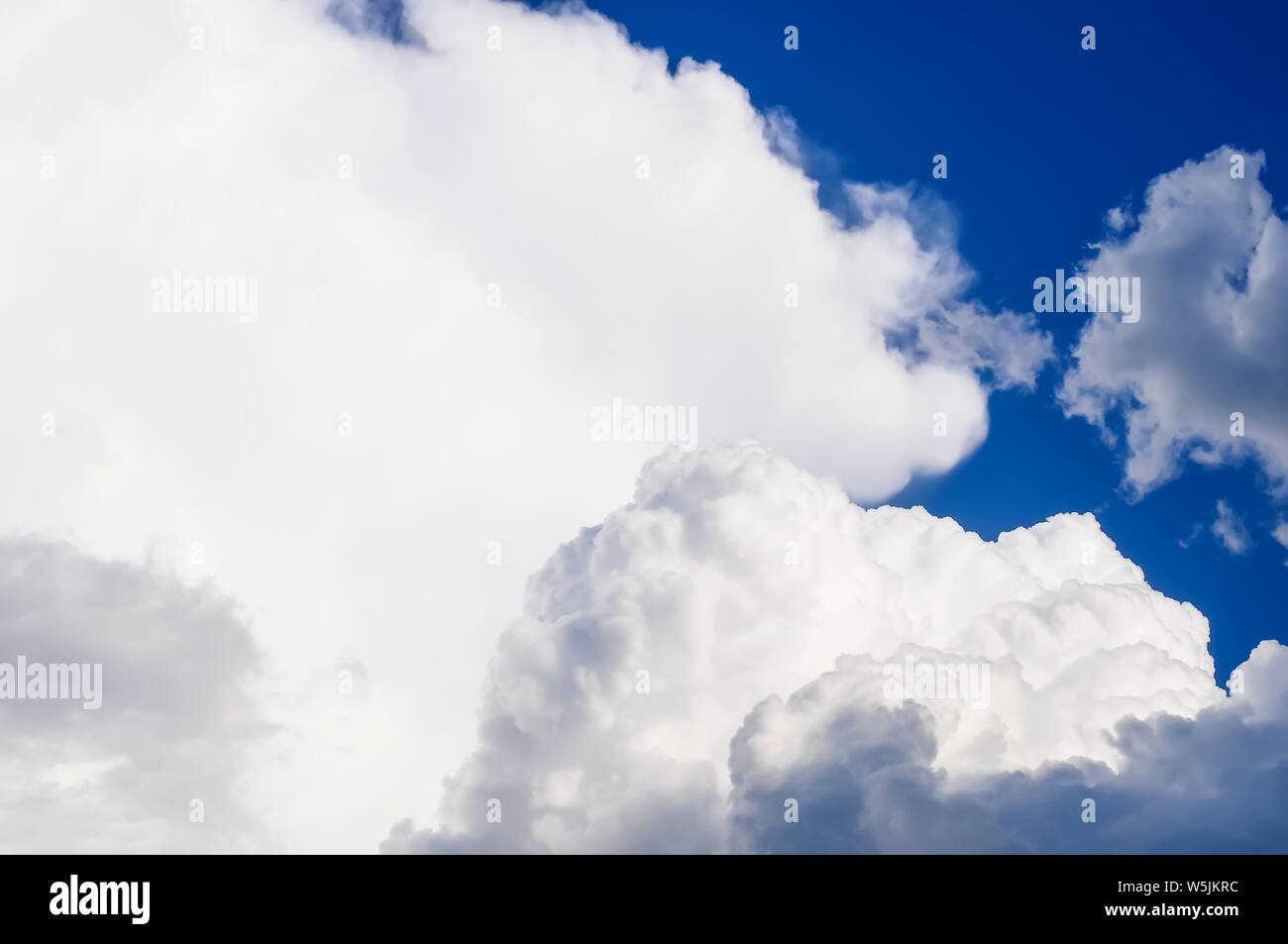 Blue sky background with detail clouds with shadow Stock Photo - Alamy