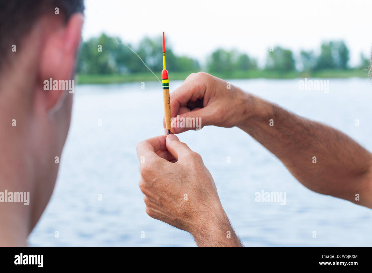 Father teaching son how to fishing in river Stock Photo - Alamy