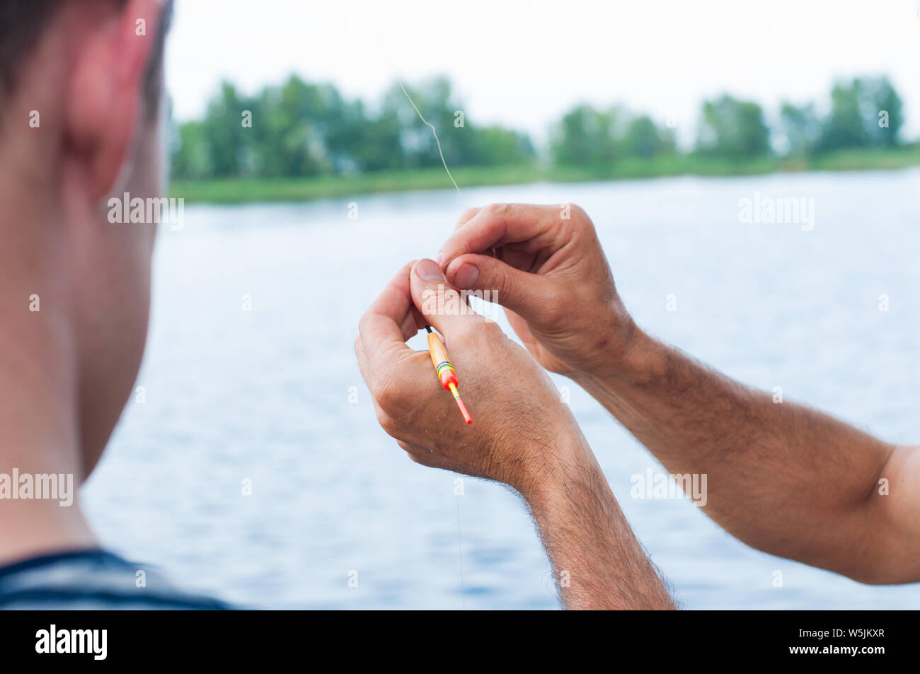 Father teaching son how to fishing in river Stock Photo - Alamy