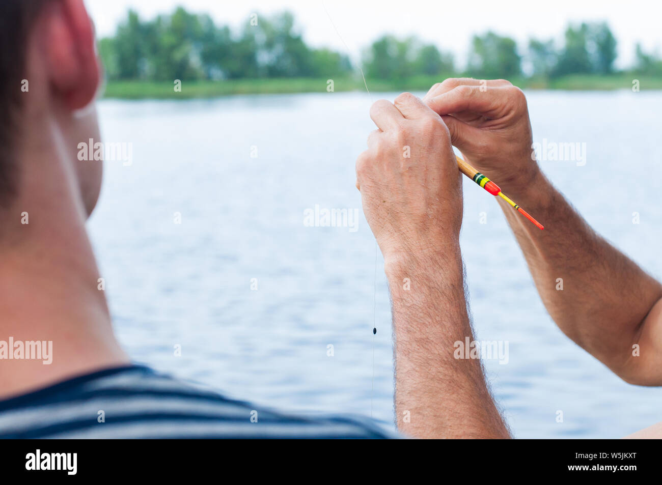 Father teaching son how to fishing in river Stock Photo - Alamy