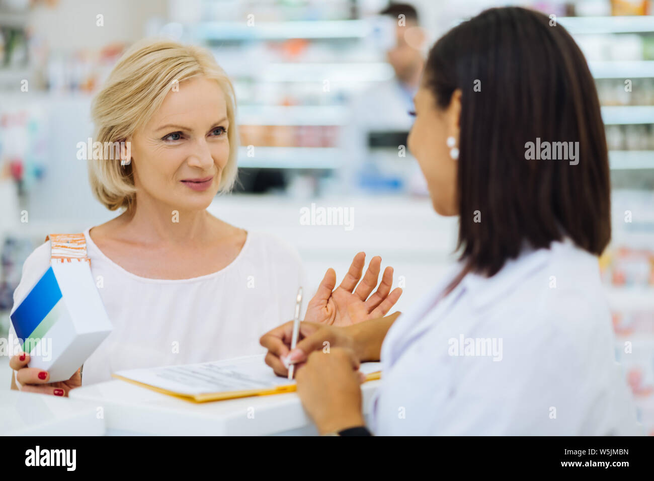 Asking colleagues for help hi-res stock photography and images - Alamy