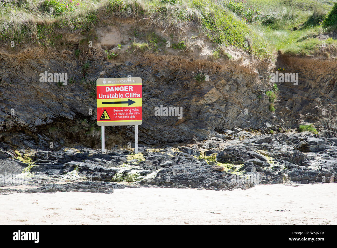 Cornwall, England June 2019, A sign warns visitors to the beach of ...