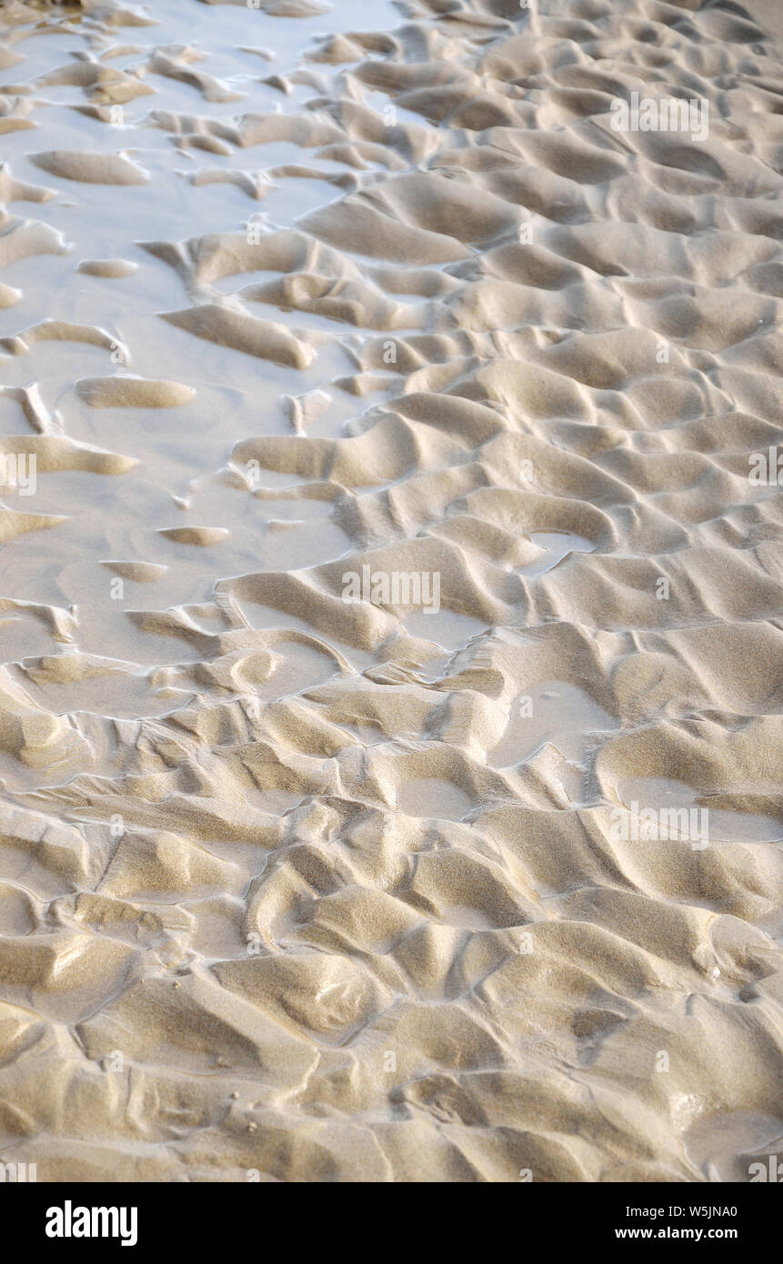 Abstract background of thin wet sand Stock Photo - Alamy