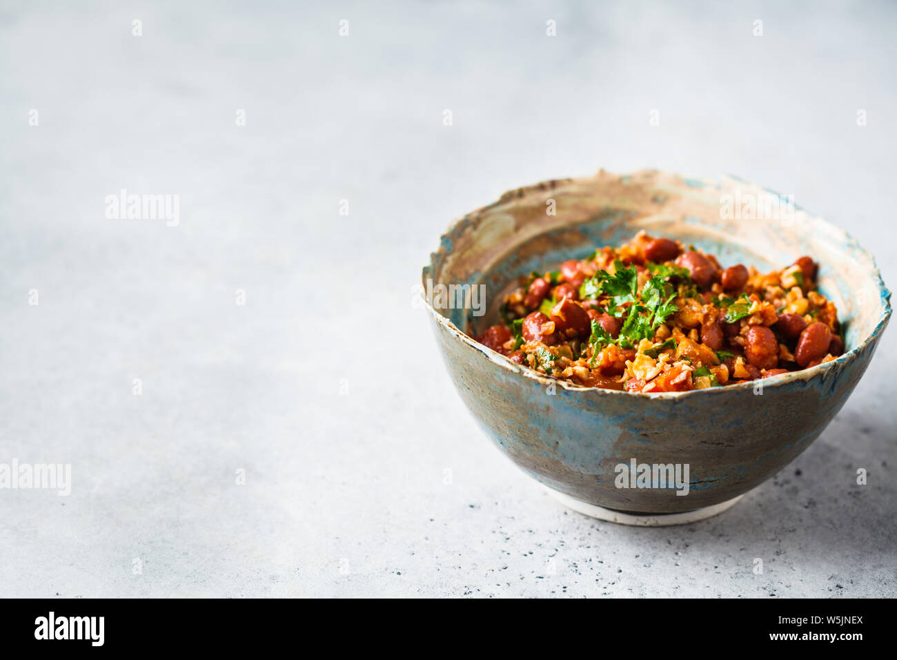Georgian traditional beans lobio in a bowl on a white-gray background ...