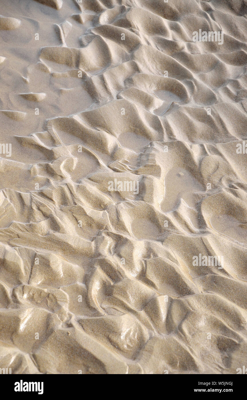 Abstract background of thin wet sand Stock Photo - Alamy