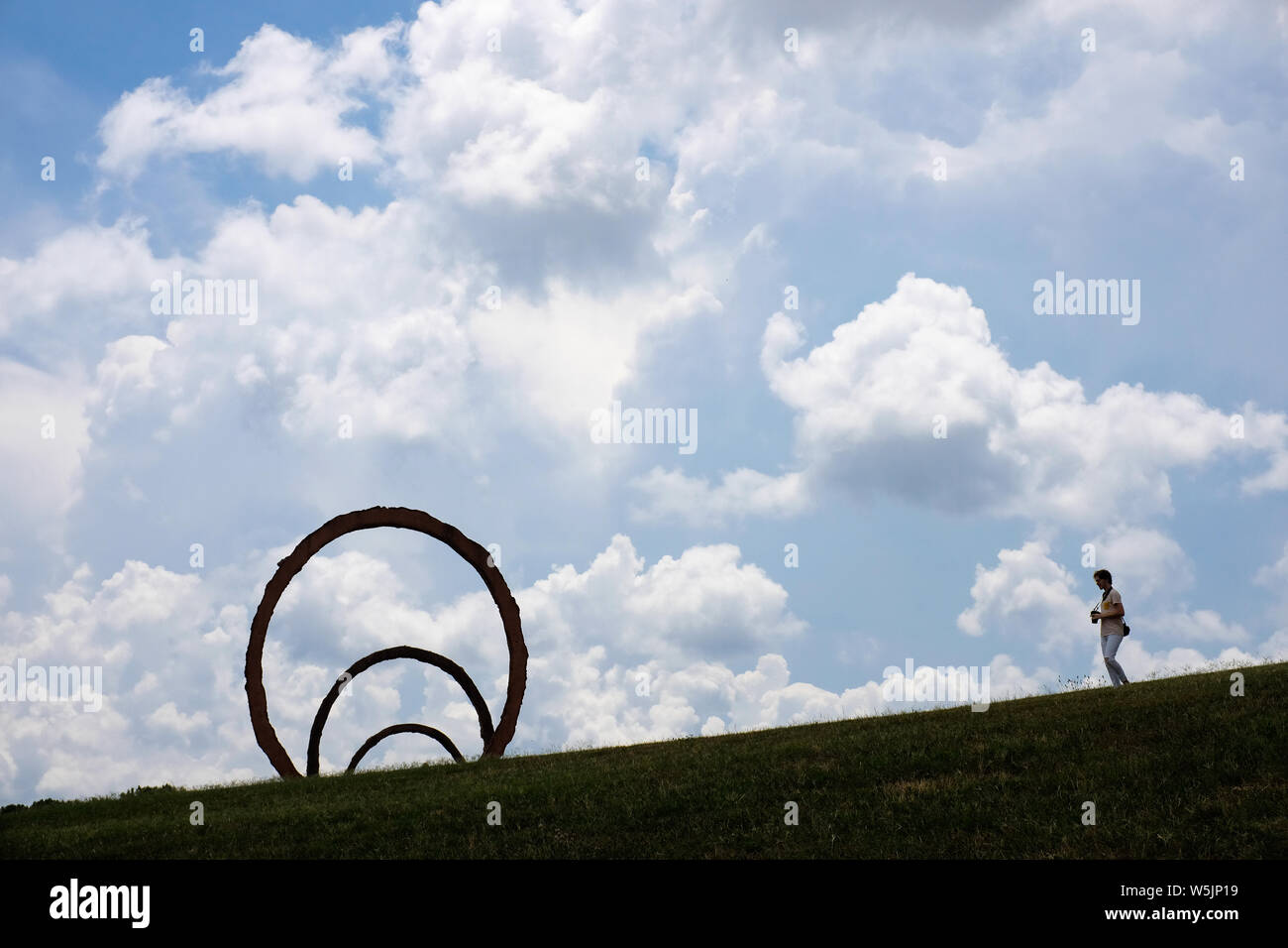 Thomas Sayre's 'Gyre' sculpture silhouetted against dramatic clouds at ...