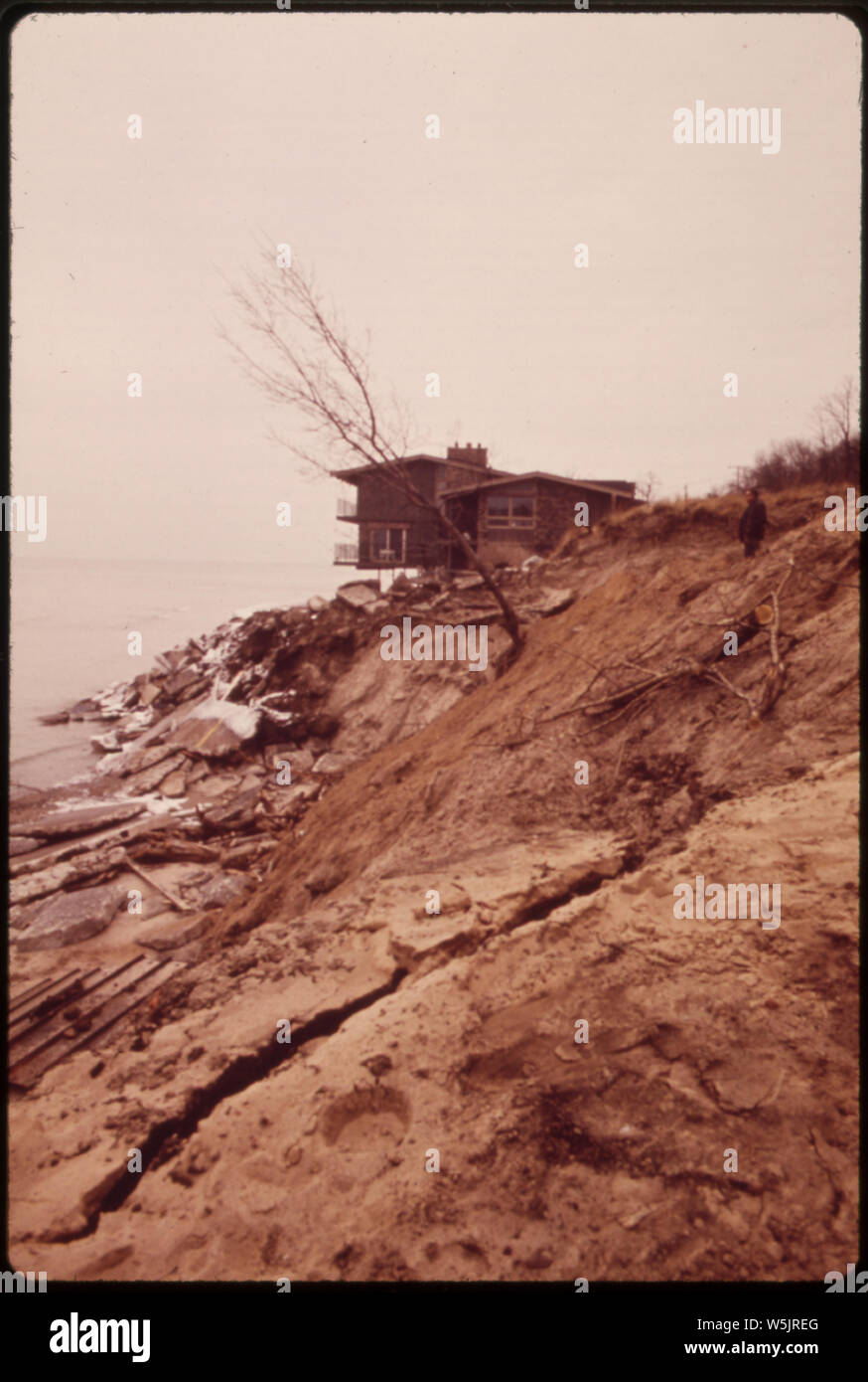 AFTERMATH OF SEVERE LAKE STORM AT BEVERLY SHORES. ERODED CLIFF LEAVES ...